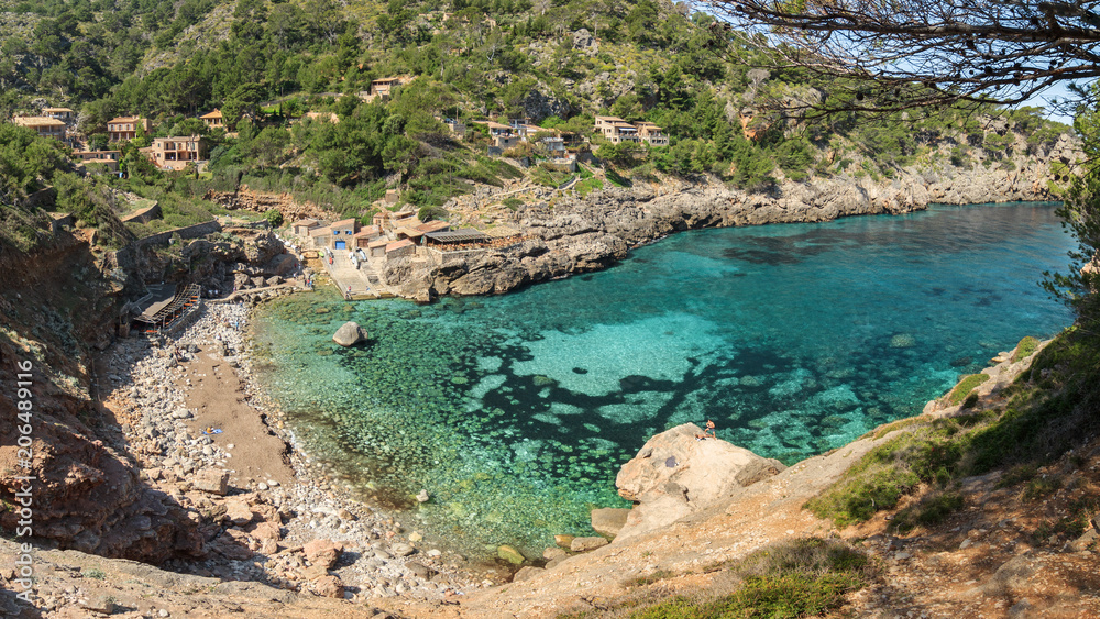 Charming beach cove with transparent crystal water in Mediterranean sea ...