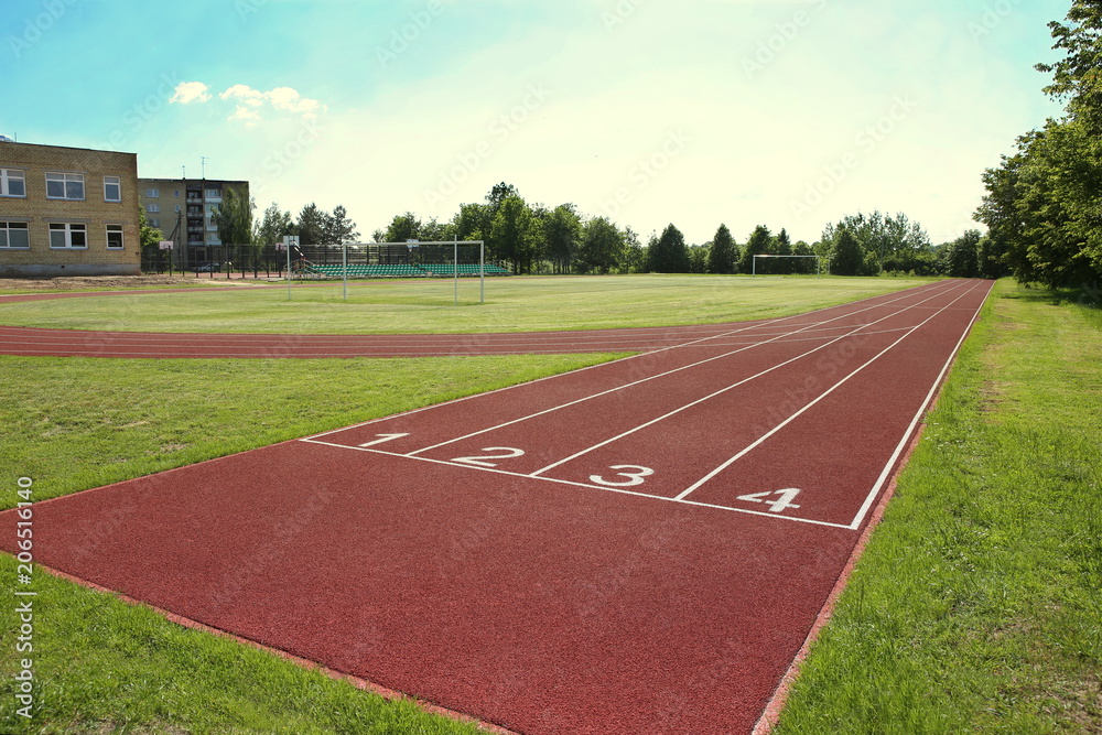 Numbered start track in stadium. Start line with numbers and lanes on ...