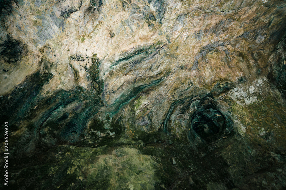 Beautiful cave. View from inside dark dungeon. Textured walls of cave ...