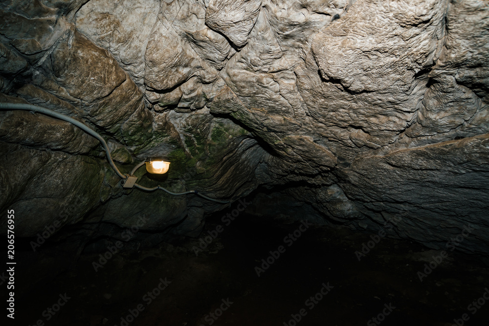 Beautiful cave. View from inside dark dungeon. Textured walls of cave ...