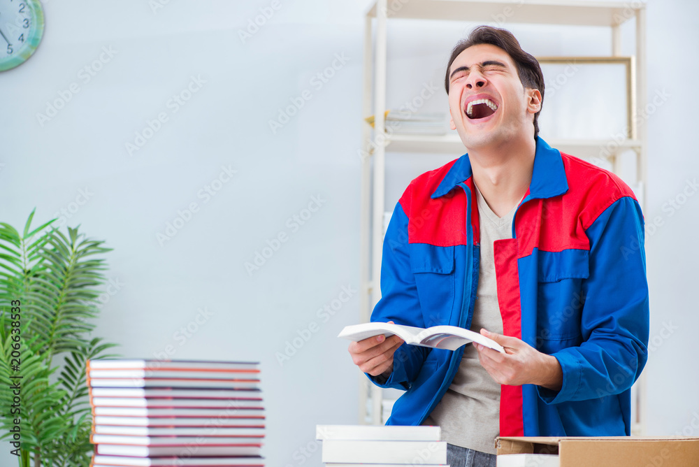 Worker in publishing house preparing book order Stock-Foto | Adobe Stock