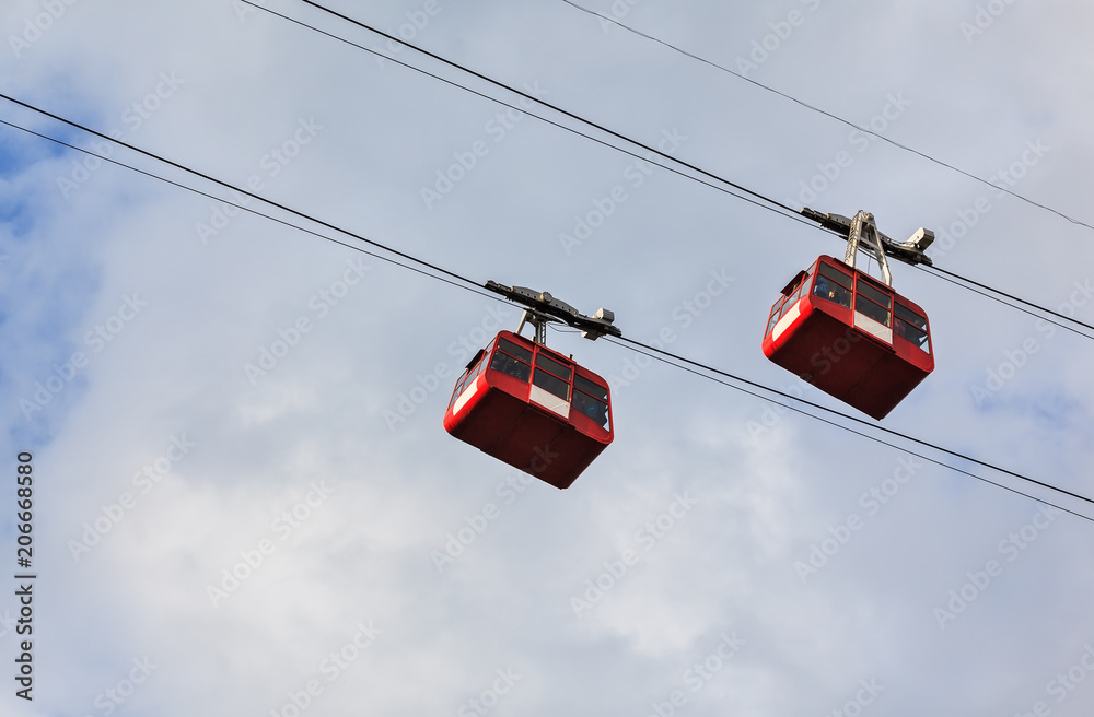 The two red cabin of the ropeway in the capital of the Indian state of ...