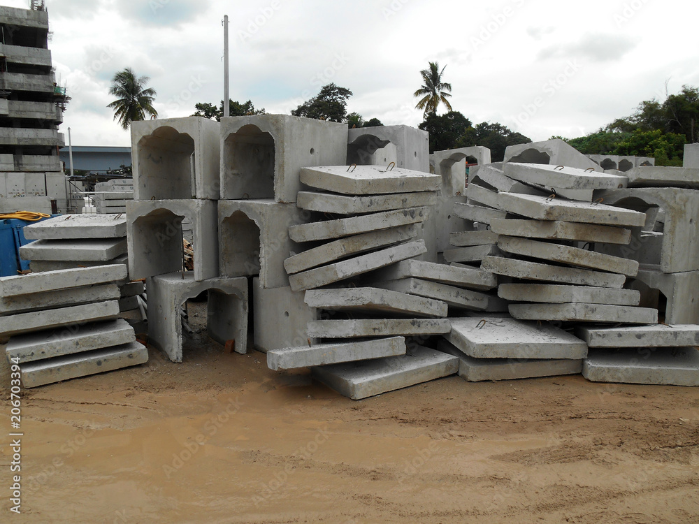 Precast concrete u-shape drain stock stacked at the construction site ...