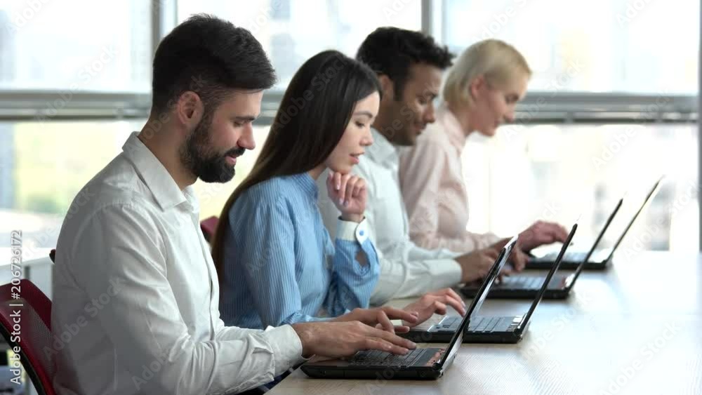 Team of smart programmers, side view. Collective of smart programmers ...