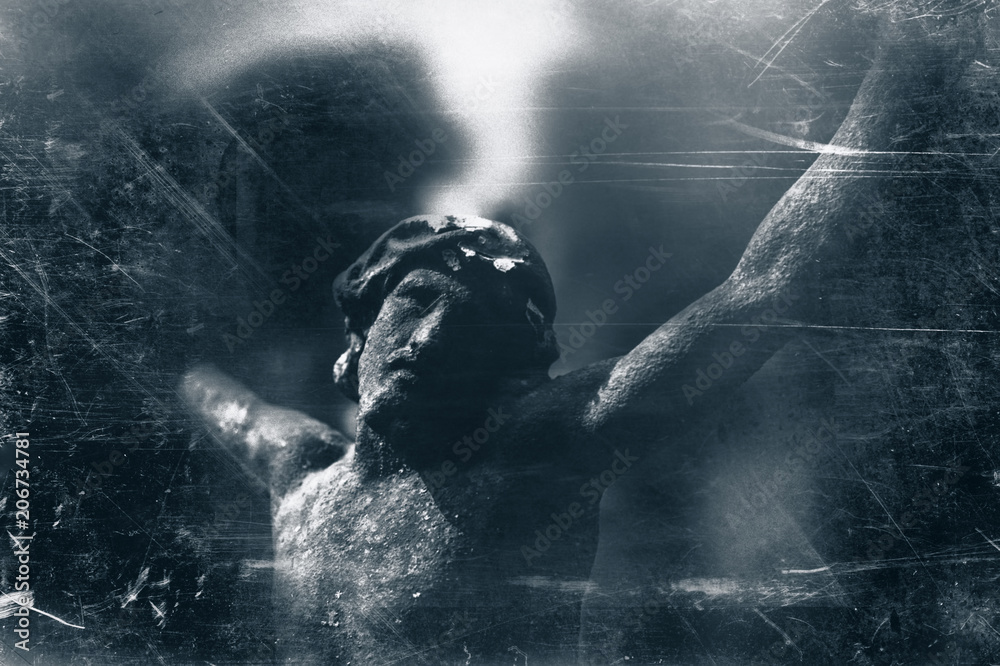 Retro styled destroyed ancient statue of the crucifixion of Jesus ...