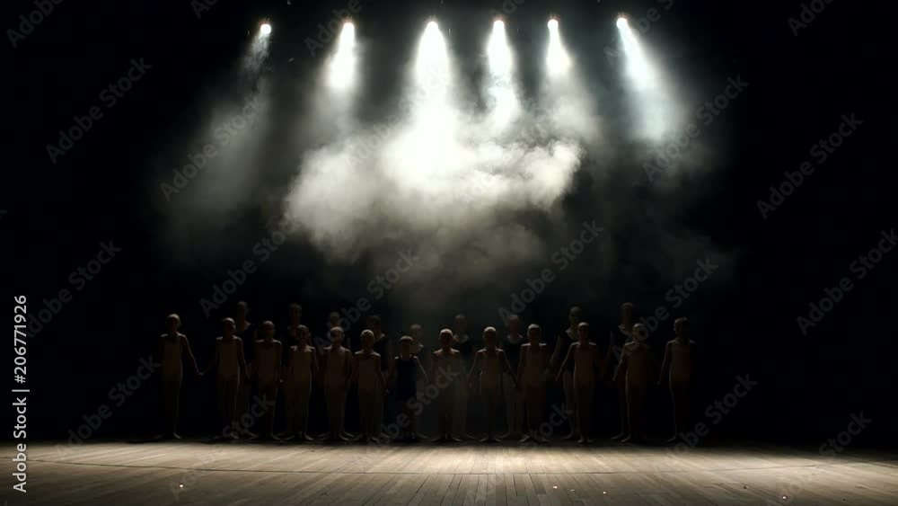 A large group of children of the dancers synchronously go on stage in ...