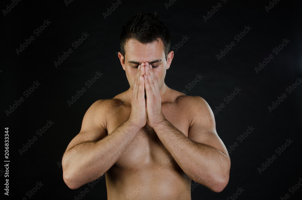 Sexy guy crying. Black background. Stock Photo | Adobe Stock