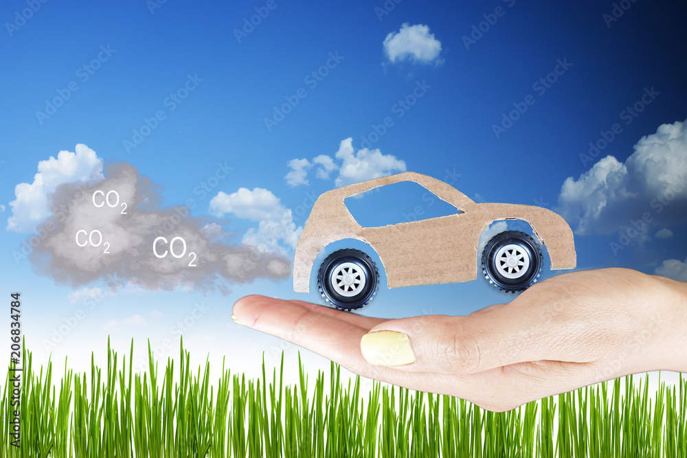 CO2 pollution concept with cardboard model car with exhaust smoke ...