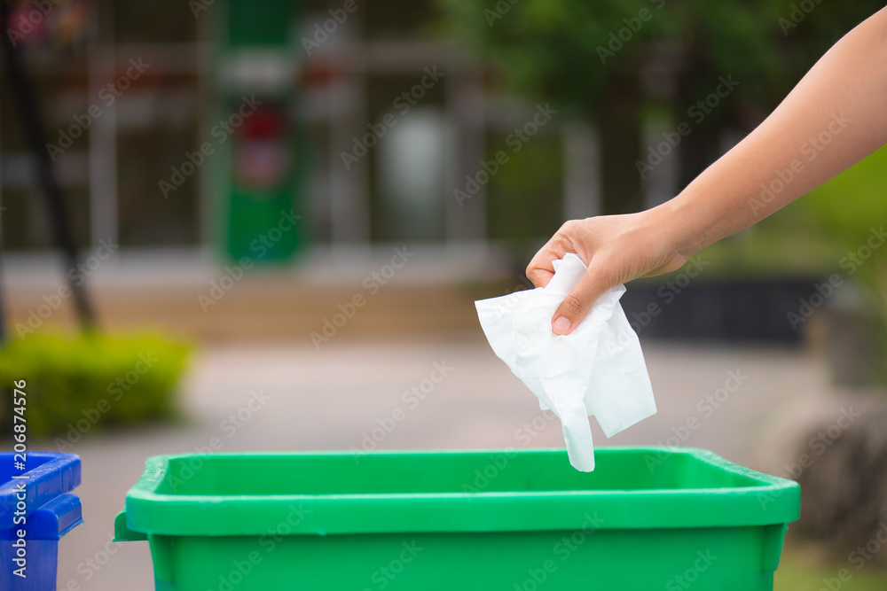 World Environment Day, June 5. Woman hand holding and putting tissue ...