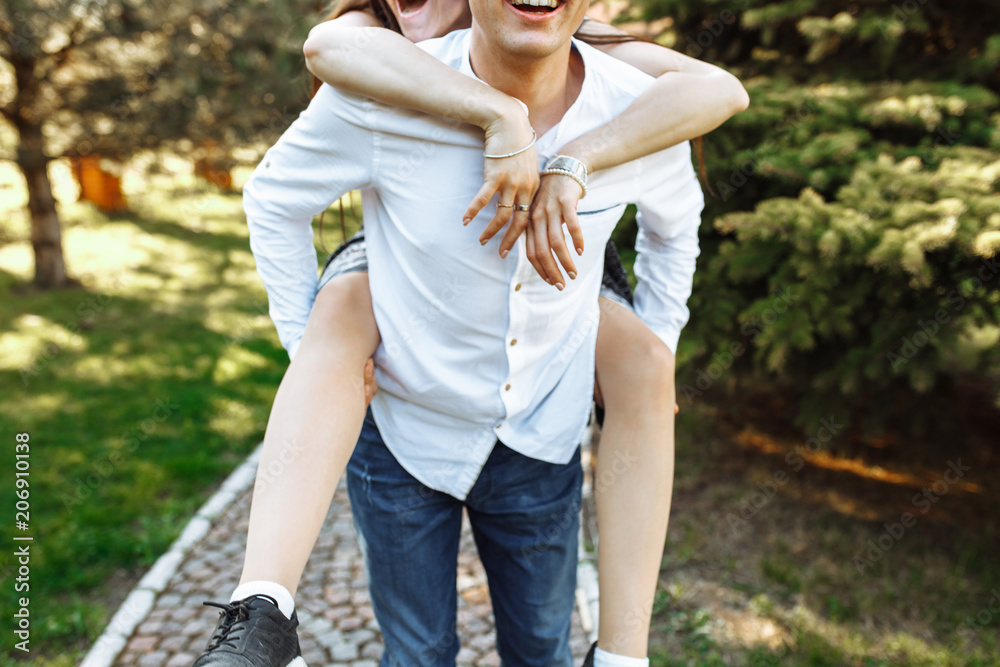 young, happy, loving couple, frolic and have fun in the Park, and enjoy ...