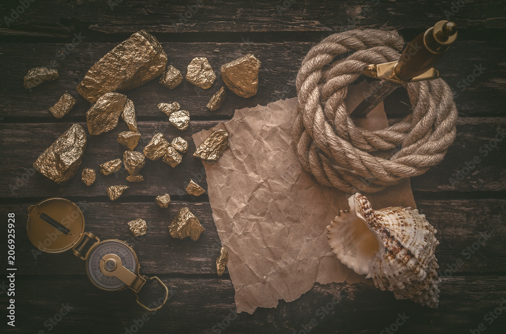 Pirate gold and treasure map crumpled parchment with copy space, dagger ...