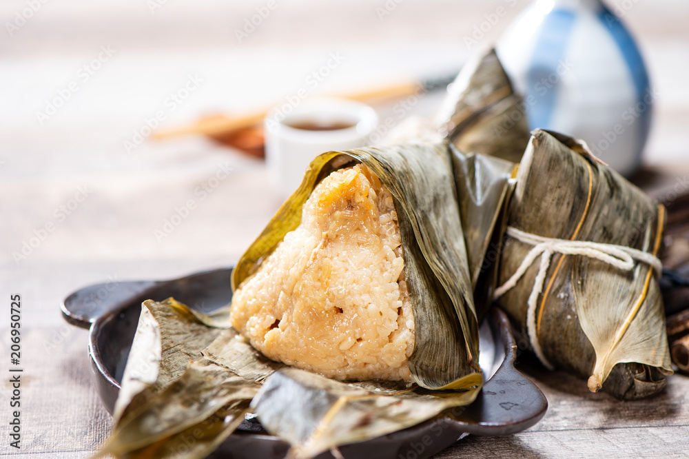zongzi(rice dumpling) with a cup of tea on a wood table, Dragon Boat ...
