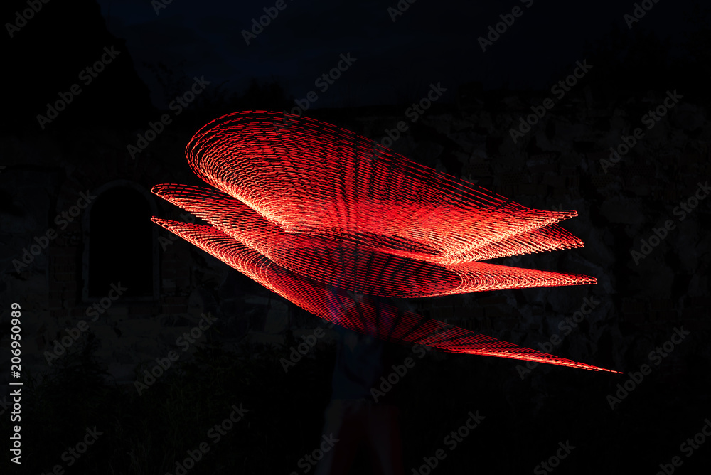 Red Light Painting, long exposure photography, loop and swirl against a ...