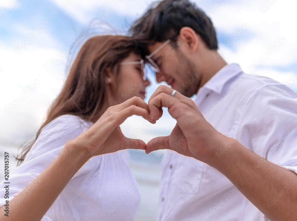couple making heart shape with hands focus on hand. Stock Photo | Adobe ...