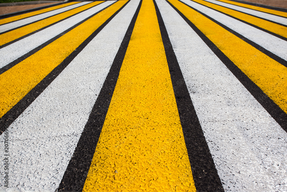 marking of the pedestrian crossing on the new asphalt, background ...