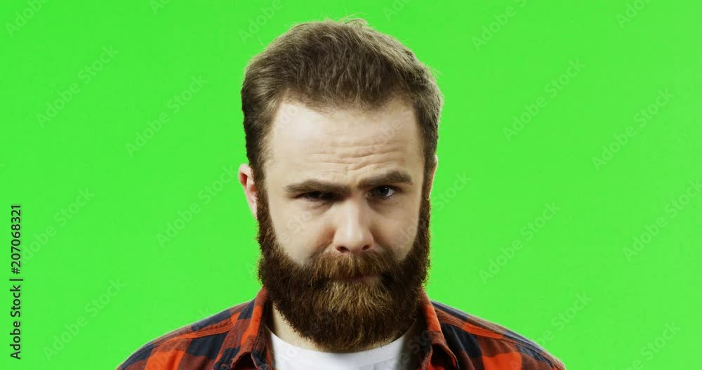 Vidéo Stock Close up of the funny man with a beard having fun and ...