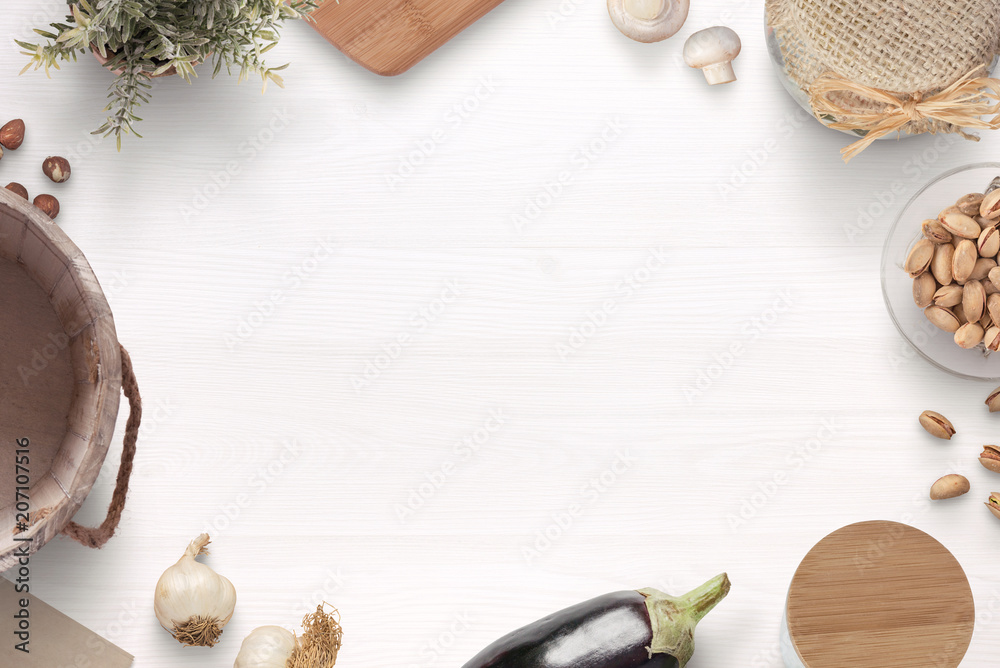 White wooden kitchen table with ingredients and kithen items. Copy ...