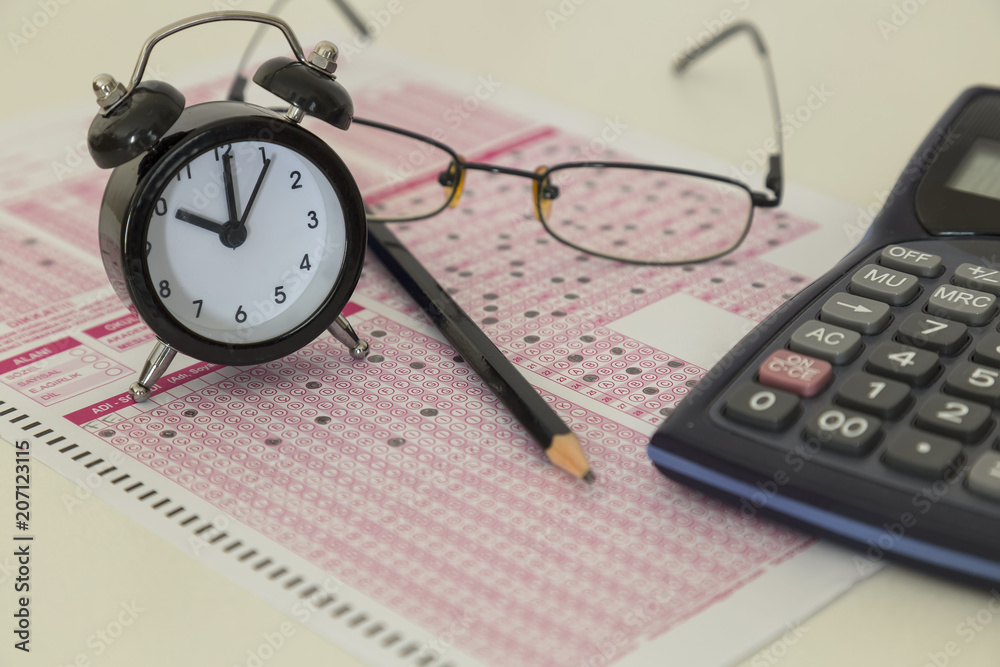 optical form and student selection and placement test,clock,glasses,pen ...