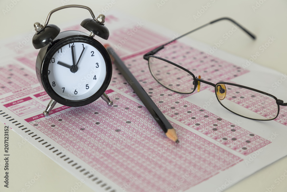 optical form and student selection and placement test,clock,glasses,pen ...