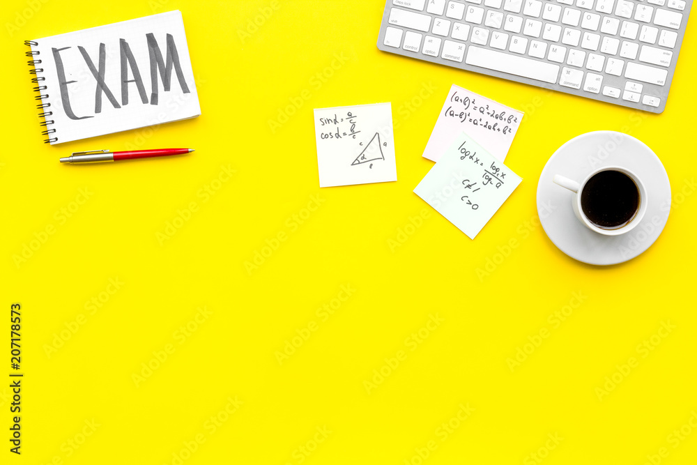 Preparing for the exam. Word Exam written in notebook on student's desk ...