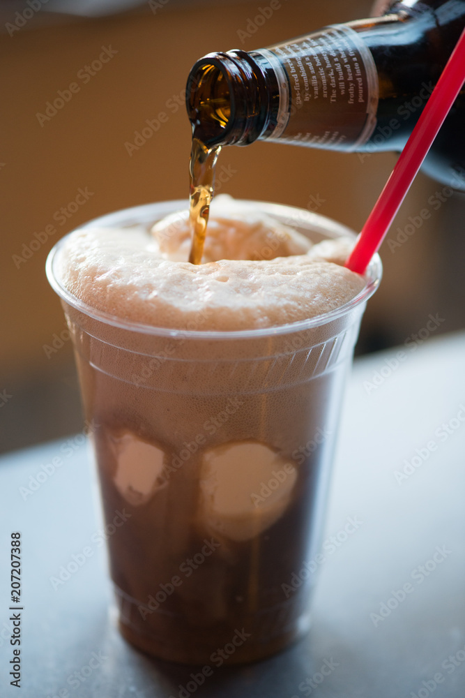 Root beer pouring into a root beer float Stock Photo | Adobe Stock