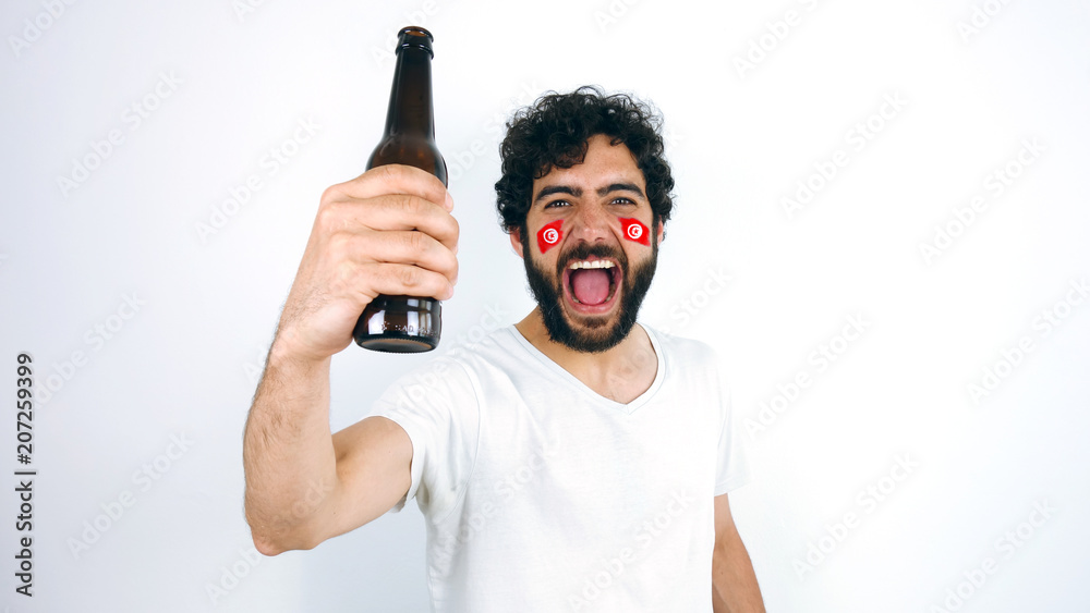Sport fan holding a beer screaming for the triumph of his team. Man ...