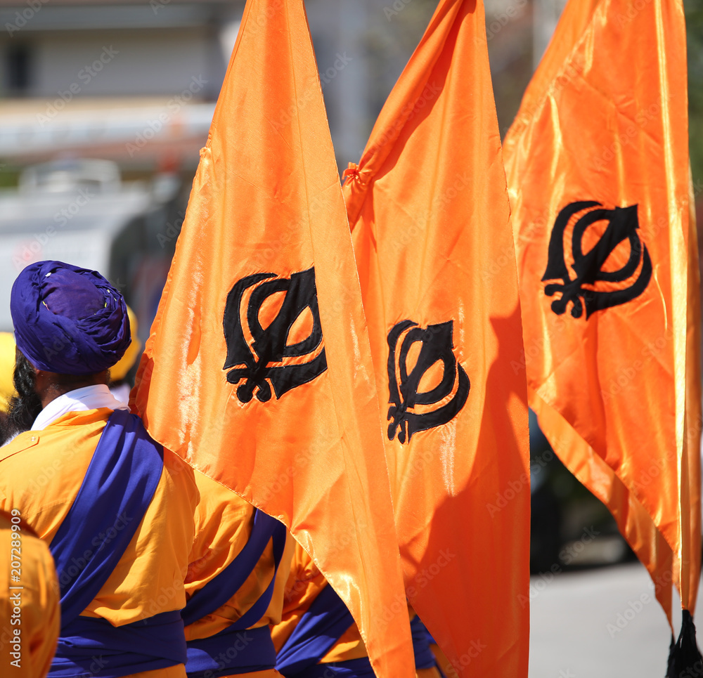 Three Flags with sikhism symbol called Khanda and a man with blu Stock ...