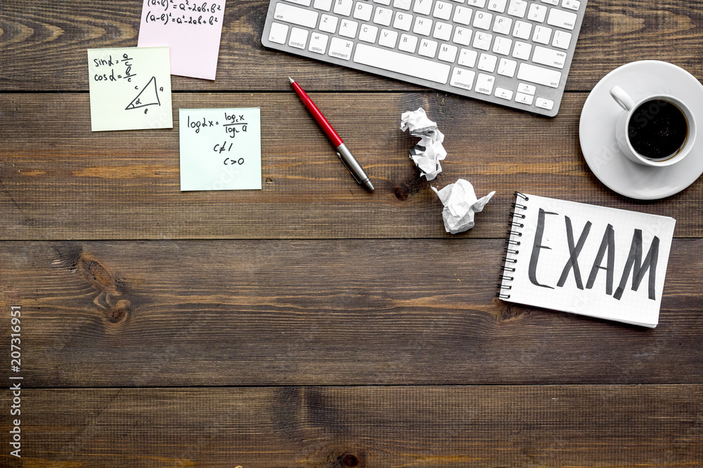 Preparing for the exam. Word Exam written in notebook on student's desk ...