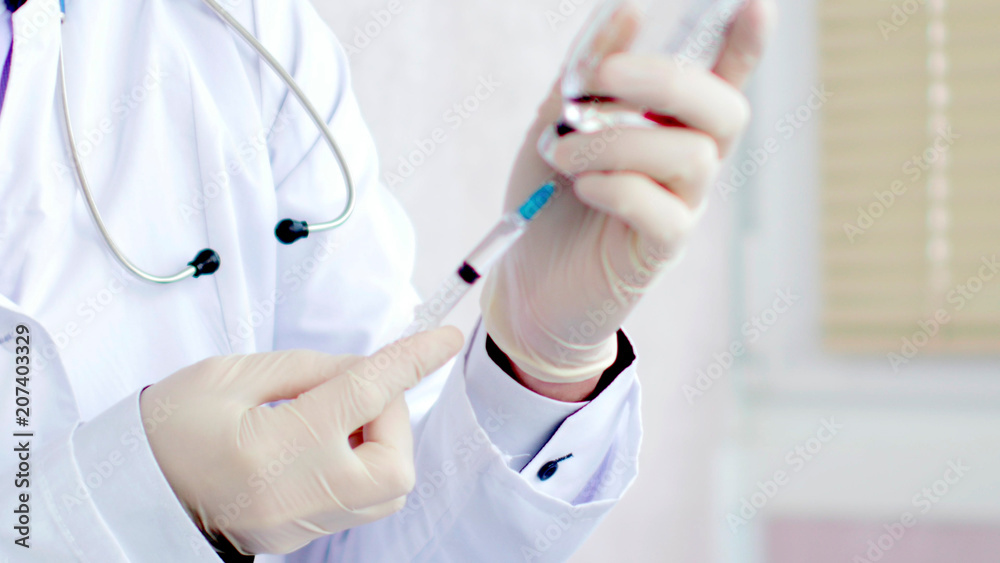 Medical doctor with syringe in hands is preparing for injection Stock ...