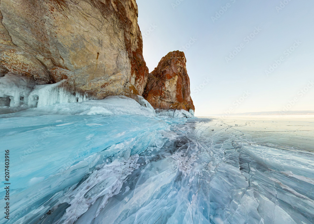 rock in the ice of Lake Baikal, the island of Olkhon. Panorama ...