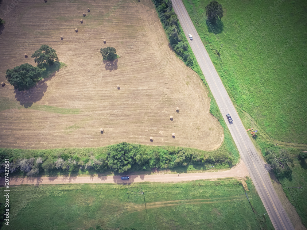 Vintage aerial prairie field at Texas Hill Country sunny day. Bale hay ...