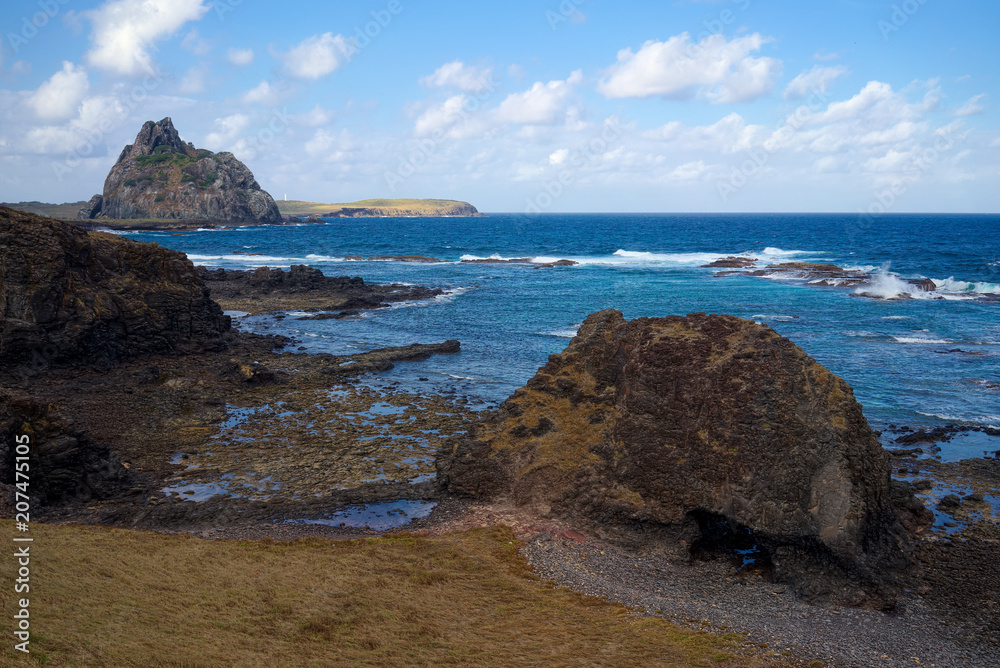 Raquel's Hole, a holed rock at the Island of Fernando de Noronha ...