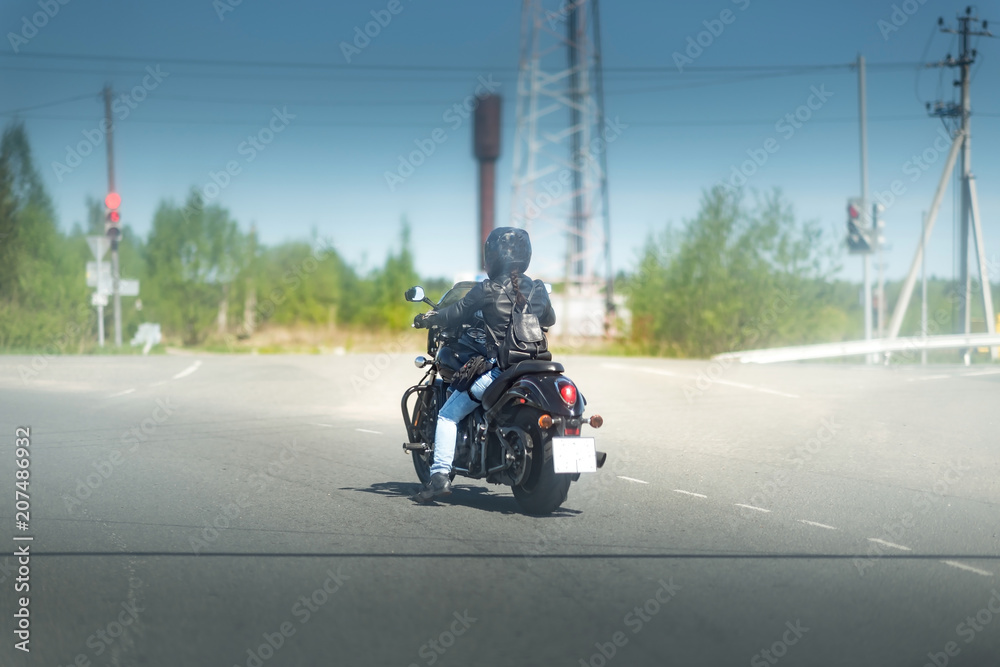 Sexy Biker Female In Black Leather Jacket And Helmet Sit On Vintage Big Black Motorcycle