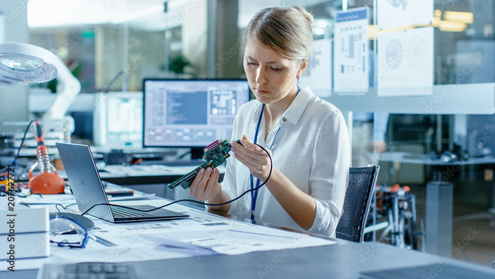 Female Computer Scientists Connects Circuit Board to Her Laptop and ...