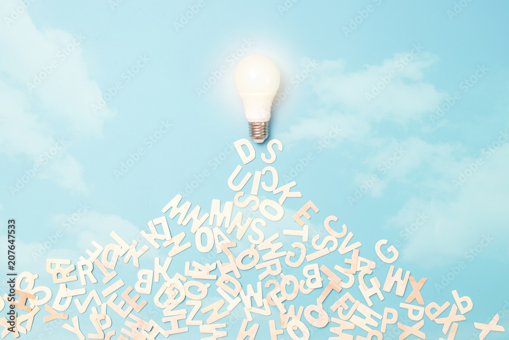 knowledge and idea concept, light bulb flying on sky and releasing ...