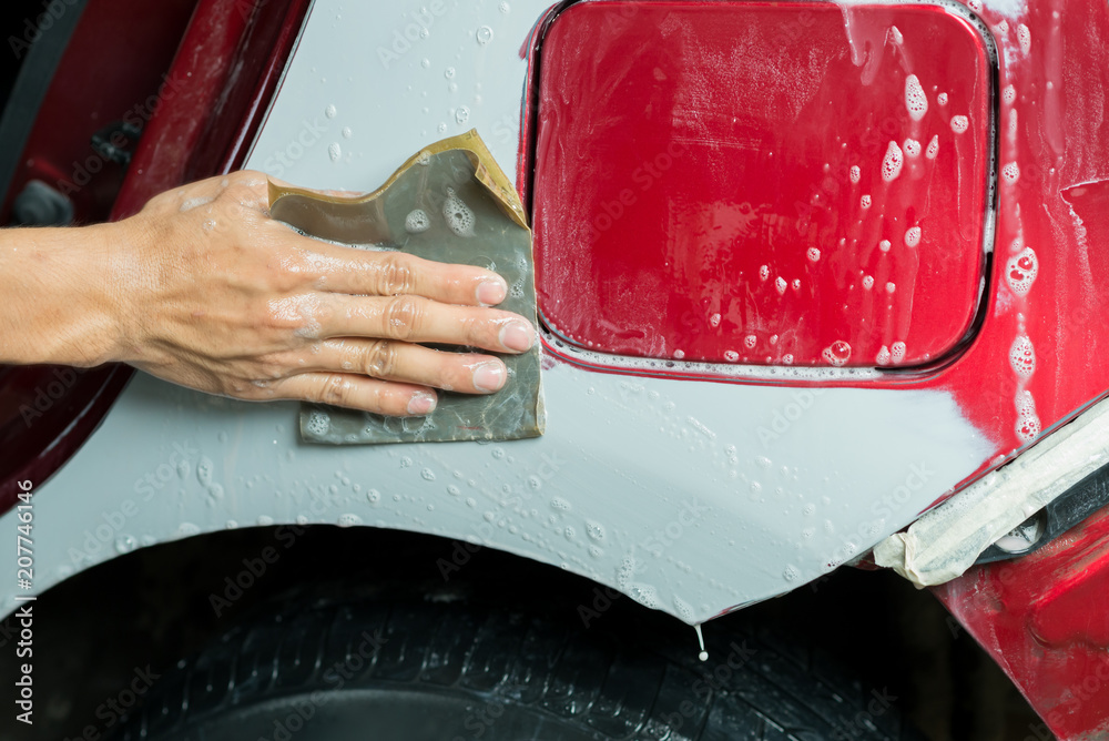 Auto body repair series: Wet sanding red car paint ภาพถ่ายสต็อก | Adobe ...