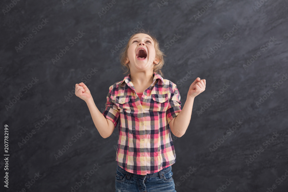 Angry little girl crying at gray background Stock Photo | Adobe Stock