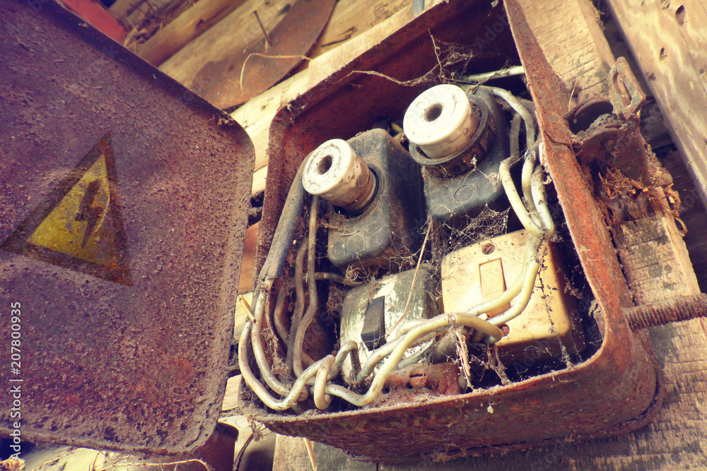 Overloaded electrical circuit causing electrical short and fire. Old ...