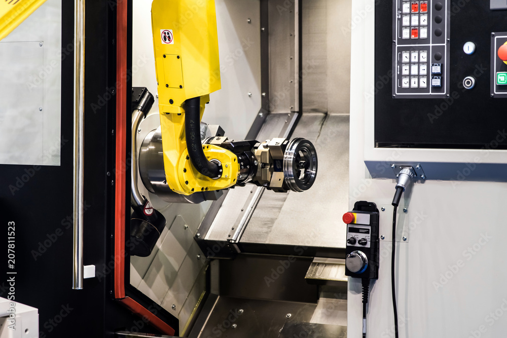 Robot hand with gripper operating with CNC machine Stock Photo | Adobe ...