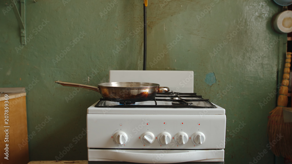 Steel pan on a gas stove in an old kitchen of a communal flat Stock ...