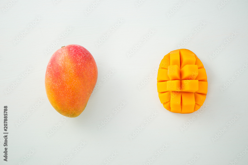 Fresh and beautiful mango fruit with sliced diced mango chunks on a ...