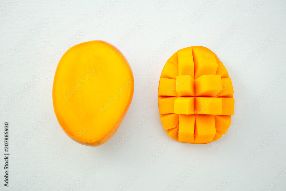 Fresh and beautiful mango fruit with sliced diced mango chunks on a ...