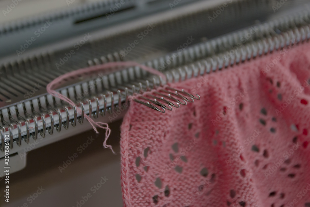 Manual knitting machine. A knitting machine is a device used to create ...