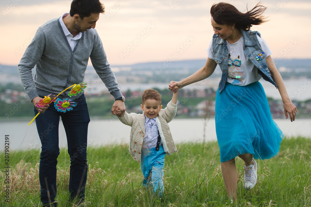 Parents Walking With Baby