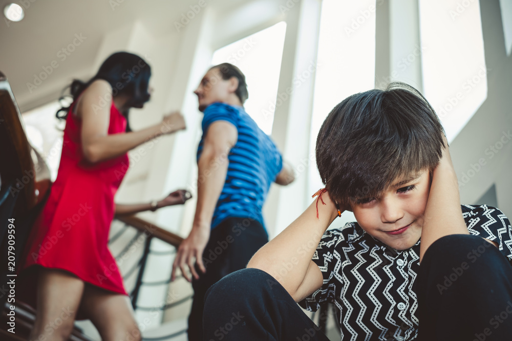 Family fighting concept, kid boy crying over fighting of parent ...