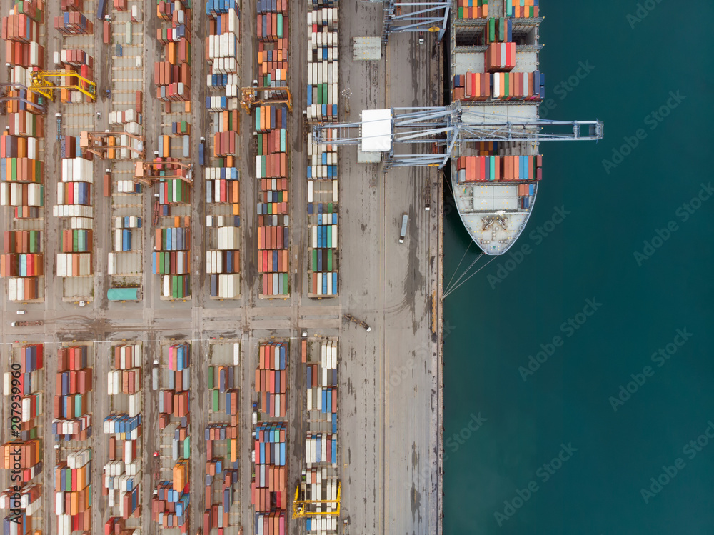 cargo container in the dock yard port with cargo ship loading big tank ...