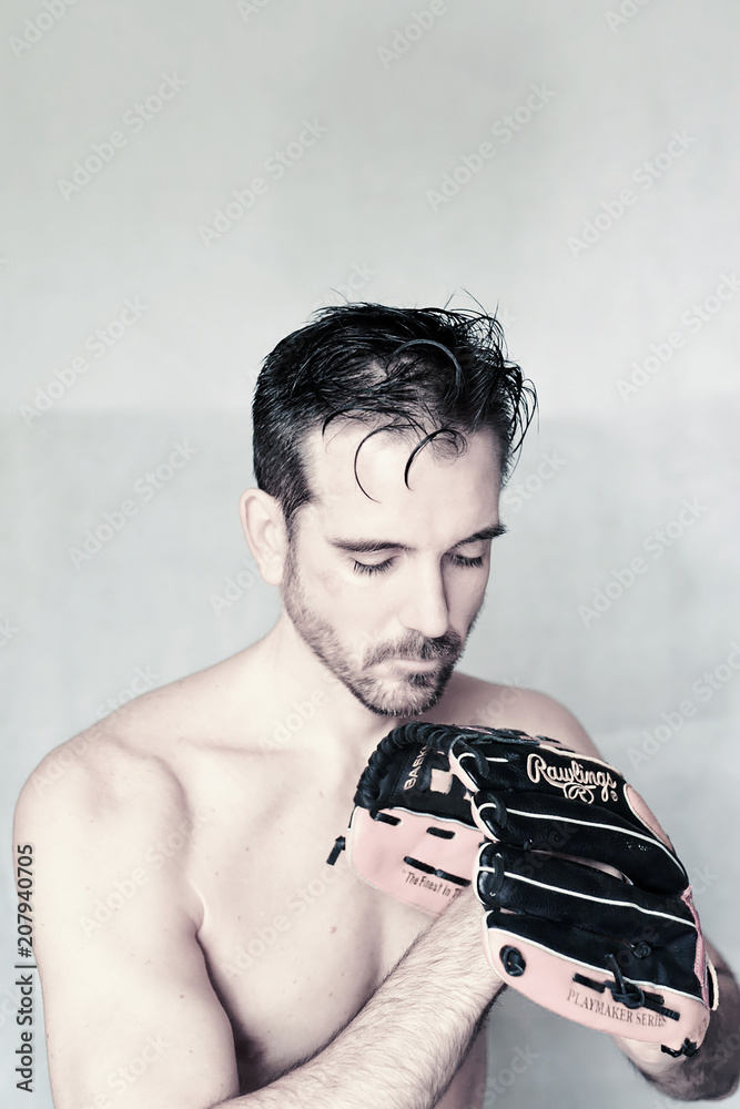 Shirtless Caucasian Male Athlete Wet In Locker Room With Fist In Glove