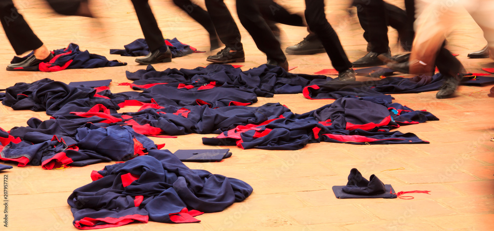 Graduate Students run over grad outfits during university graduation ...