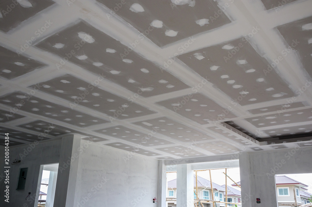 ceiling gypsum board installation at construction site Stock Photo ...