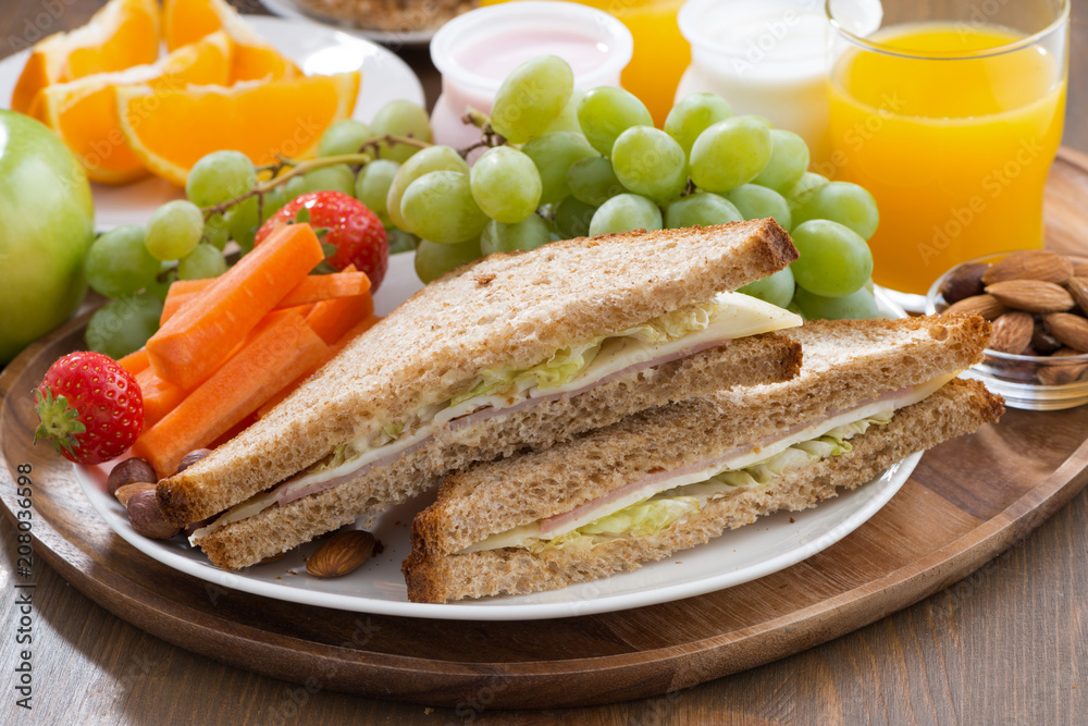 lunch with sandwiches, drinks and fruit, close-up Stock-Foto | Adobe Stock